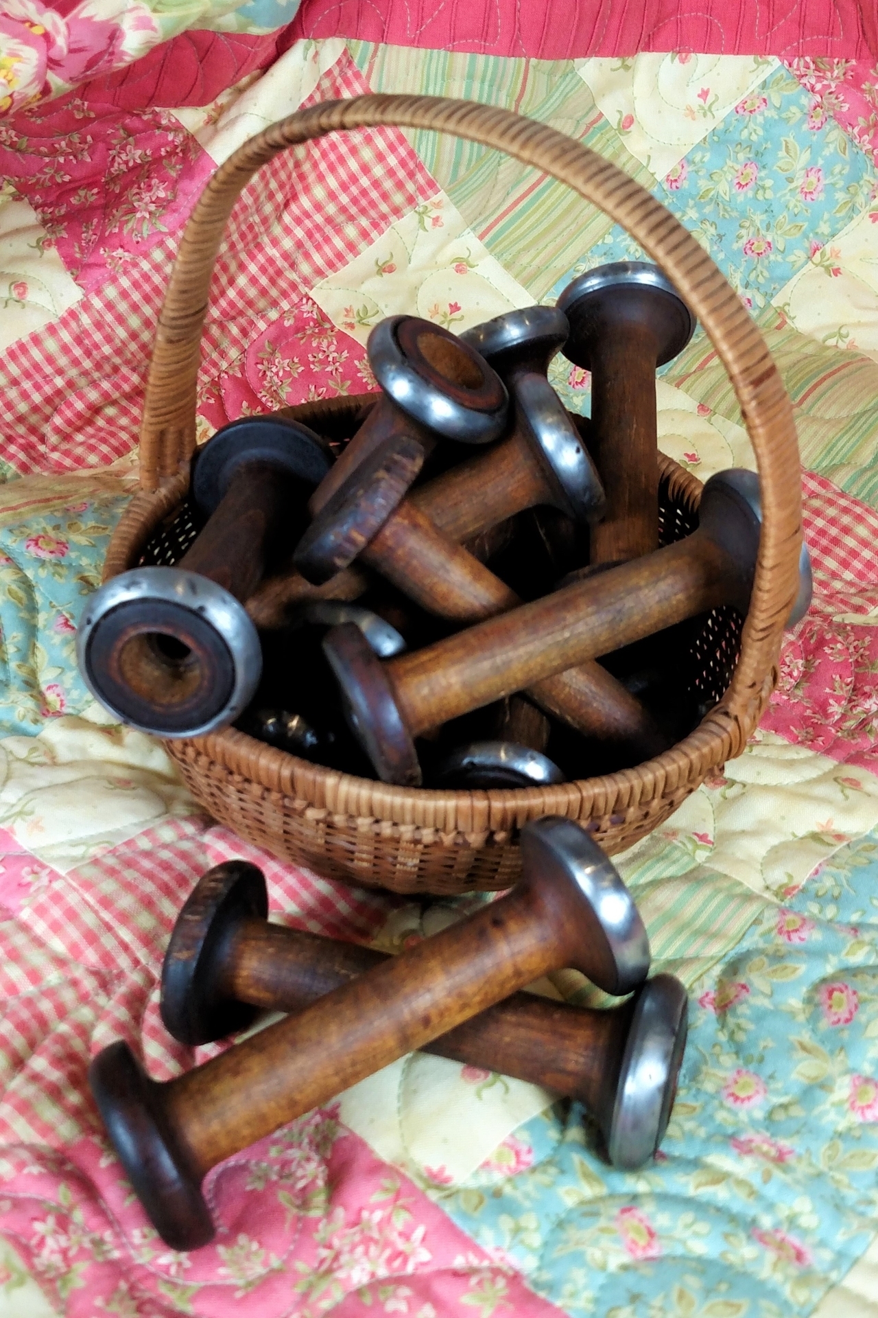 Small "Twister" Bobbin with metal cap for spinning worsted yarns.