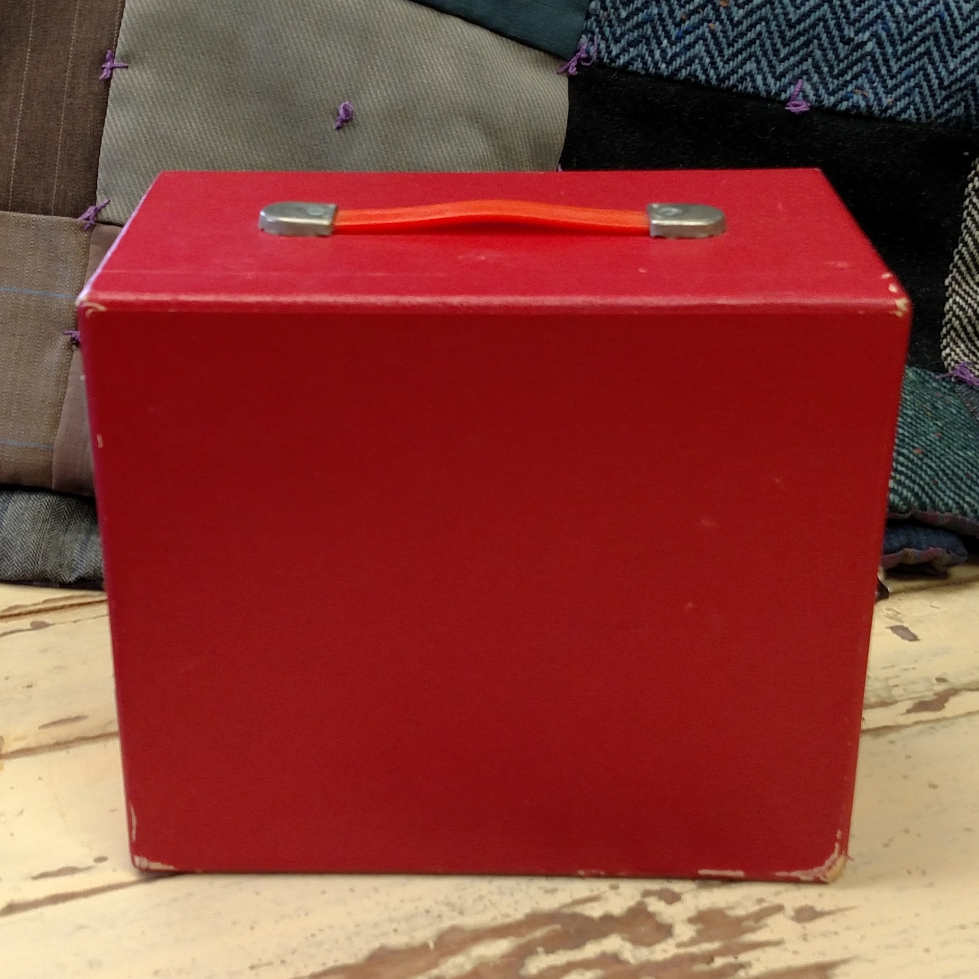 Bright Red Toy Sewing Machine for a Cheerful Sewing Room Decoration.