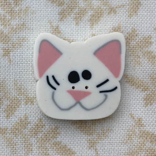 An adorable Kitty Face Button with Pink Ears.