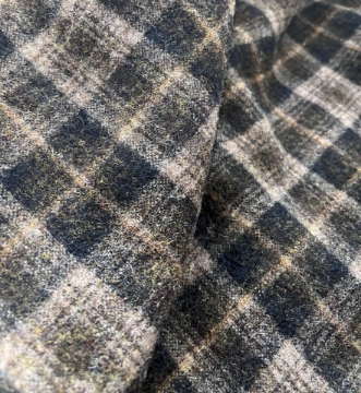 A beautiful textured wool. The wool is pre-felted and 13 oz weight.